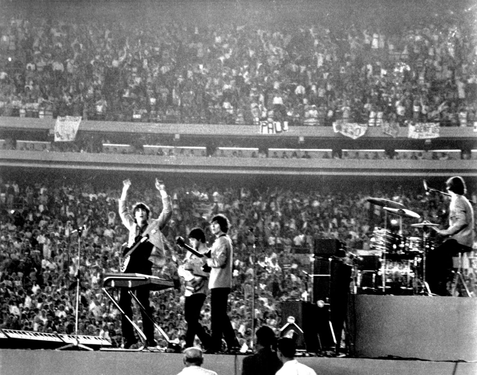 The Beatles performing on stage in the 1960s - Halo Nusantara